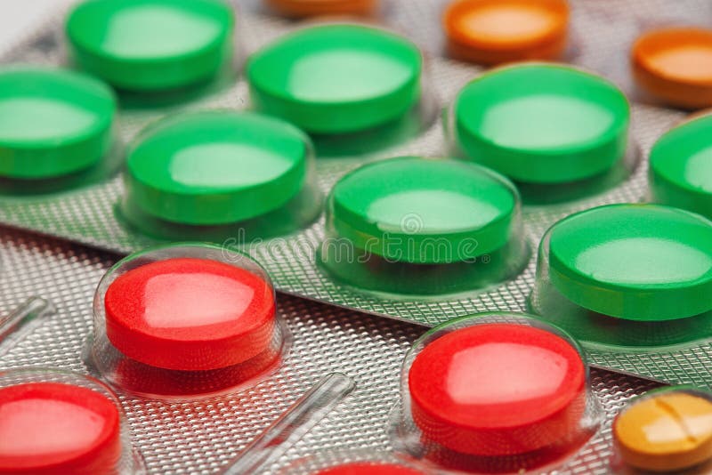 Green, Red and Orange Medical Pills in Plastic Packaging Silver Stock ...