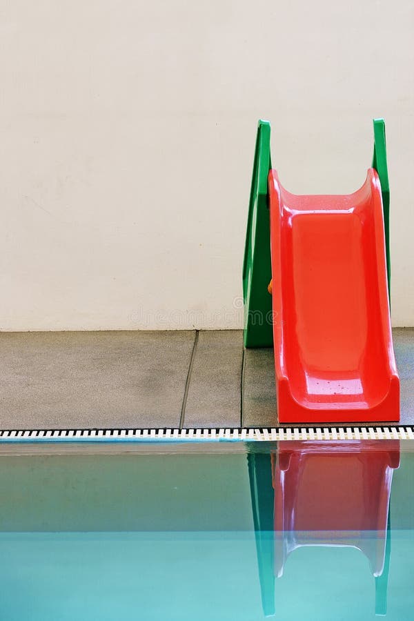 Red , Green, Water Slider in Swimming Pool Stock Image - Image of ...