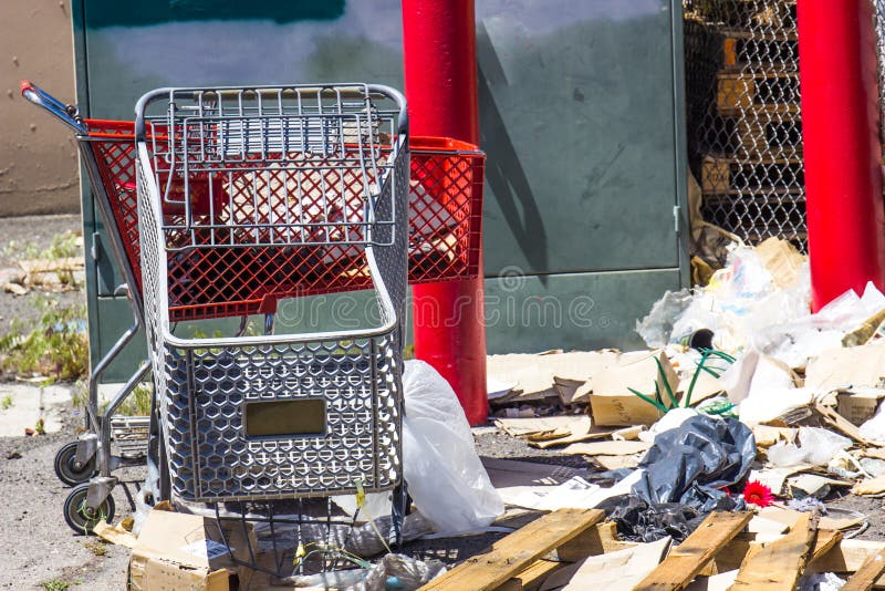 Red & Grey Shopping Baskets in Rear with Trash Stock Image - Image of ...