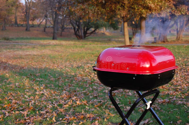 Red grill alone in park stock photo. Image of alone - 194671298