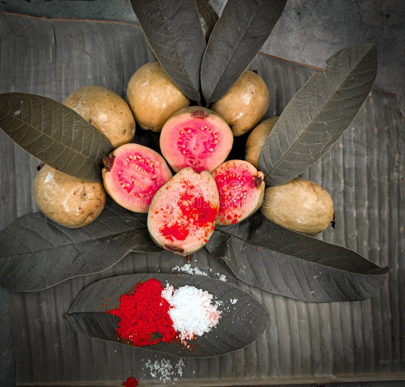 Red Guava Fruit with Banana& X27;s Green Leaf Stock Image - Image of ...
