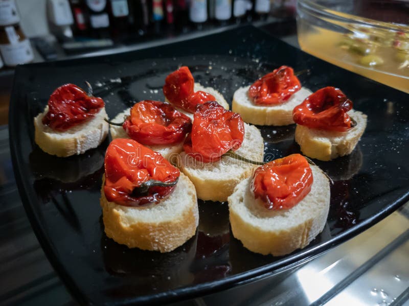 Red Habaneros on Black Plate in the Tavern Stock Photo - Image of black ...