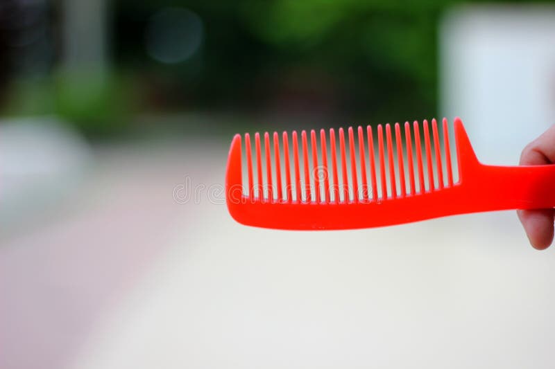Red Hair Comb with Blur Background Stock Image - Image of spring ...