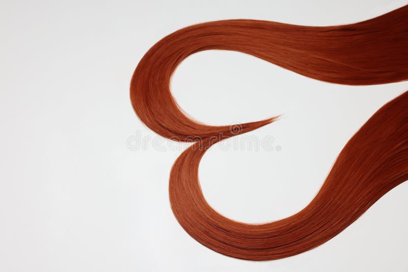 Red Hair Strands in Shape of Heart on White Background, Above View ...