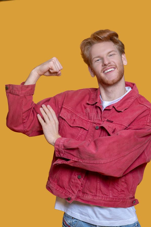 Red-haired Bearded Young Man in Red Jacket Looking Strong Stock Photo ...