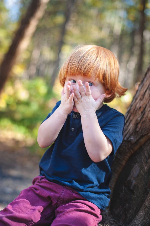Red-haired Boy Covers His Face Stock Image - Image of face, beautiful ...