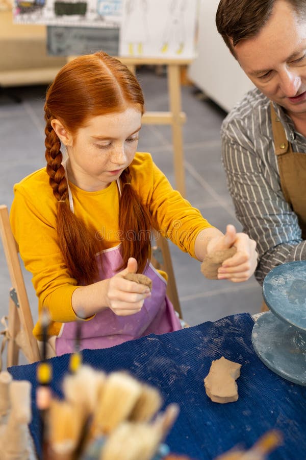 Red-haired Girl Modeling Clay Figures with Teacher Stock Image - Image ...