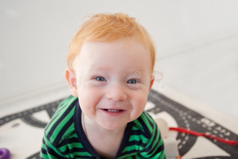 Red-haired kid smiles cute stock image. Image of redhead - 105440413