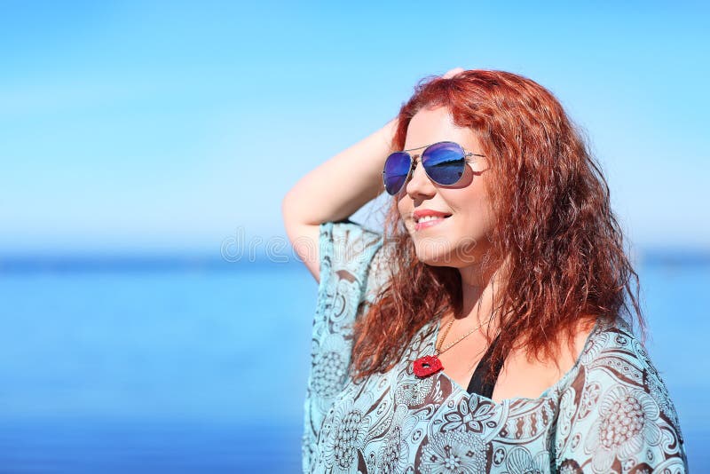 Red-haired Plus Size Woman Resting on Coast Stock Image - Image of ...