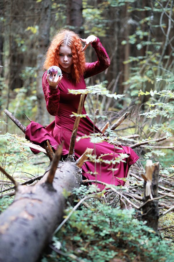 The Red-haired Witch Holds a Ritual with a Crystal Ball Stock Image ...