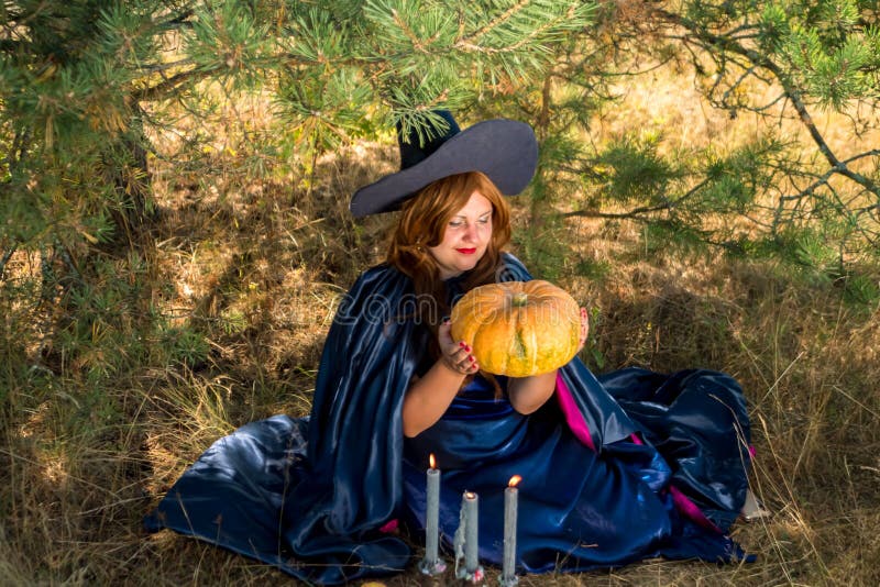 A Red-haired Witch in a Blue Cloak Dress and a Pointed Hat in the ...