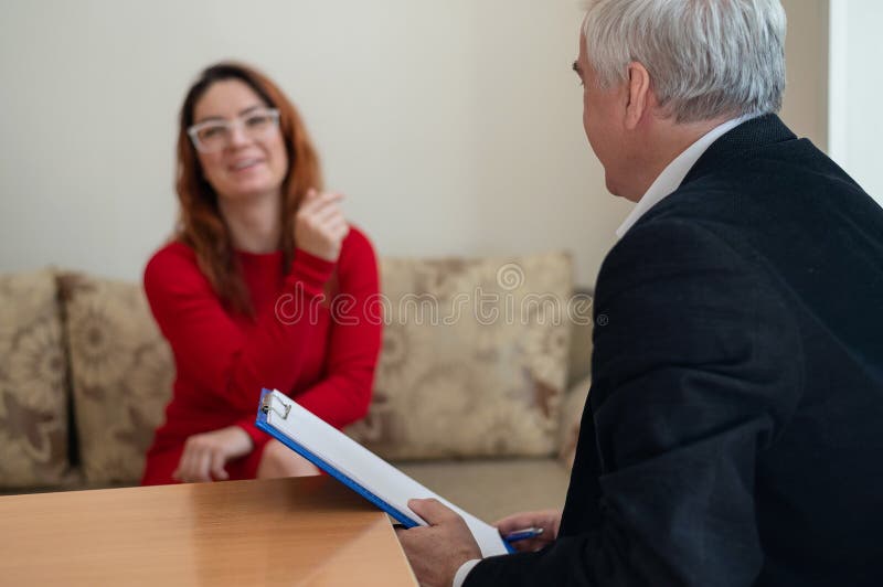 A Red-haired Woman Talks about Her Problems in a Session with a ...