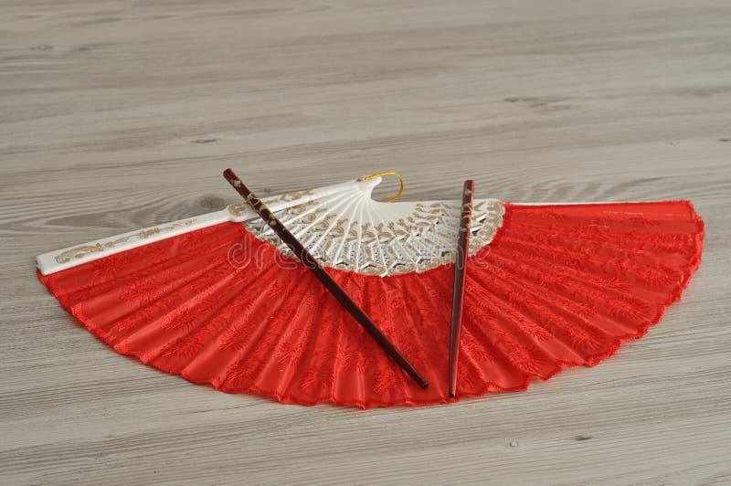 Red Hand Fan with a Set of Red Chopsticks Stock Photo - Image of ...
