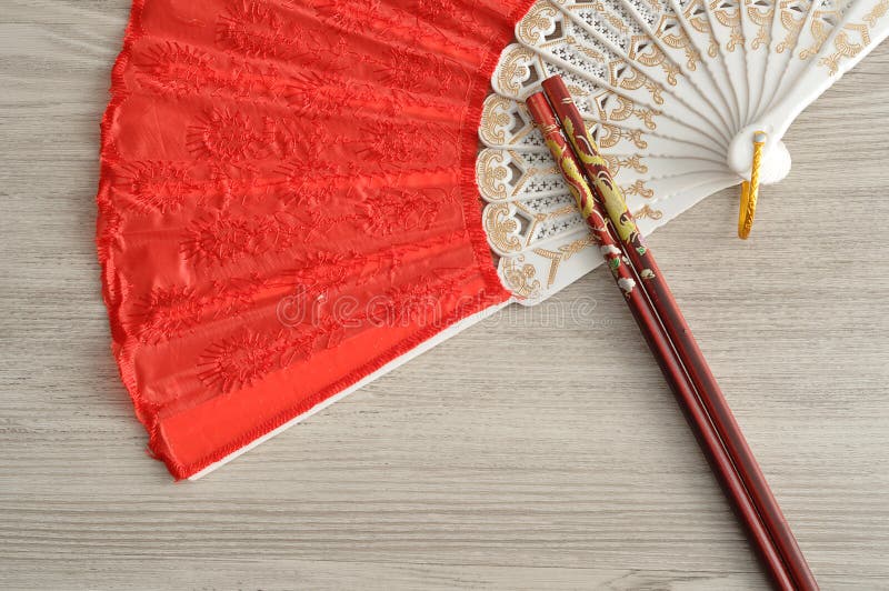 Red Hand Fan with a Set of Red Chopsticks Stock Photo - Image of summer ...