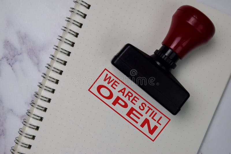 Red Handle Rubber Stamper and we are Still Open Text Isolated on the ...