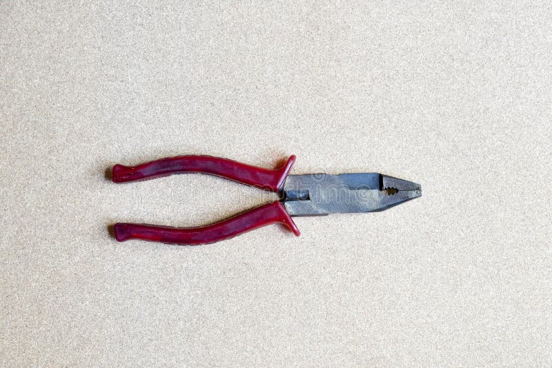 Red Handled Pliers on Wood Background Stock Photo - Image of pliers ...