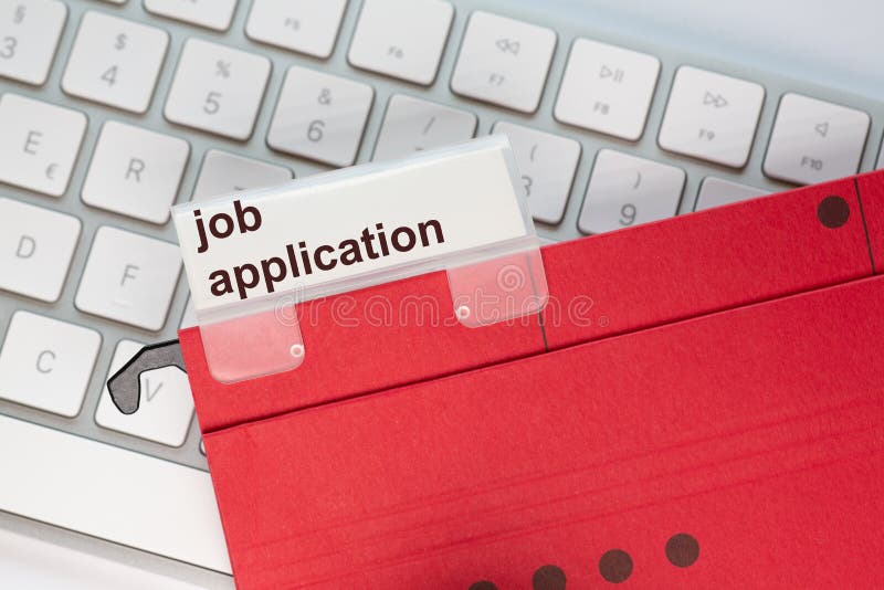Red Hanging Folder on a Keyboard Has a Tab with the Words Job ...