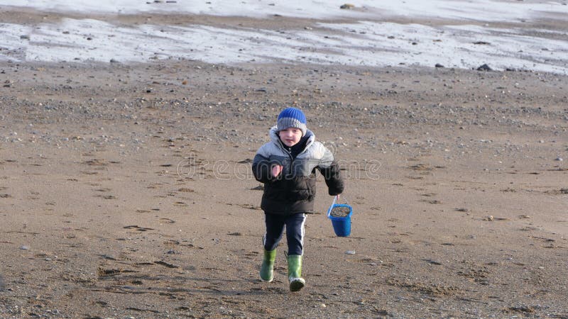 Red Headed Boy Playing with Bucket Spade and Digger on Sandy Beach ...