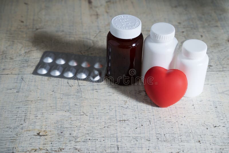 Red Heart Ball with Several Pill Bottles Stock Image - Image of pill ...
