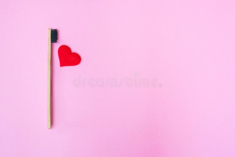 Red Heart and Bamboo Toothbrush with Copy Space on Pink Background ...