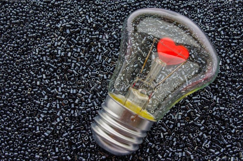 Red Heart of an Electric Bulb Stock Photo - Image of illuminate, light ...