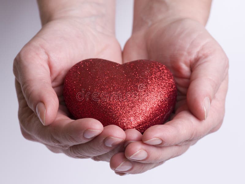 Red heart on hands stock image. Image of symbol, color - 7501733