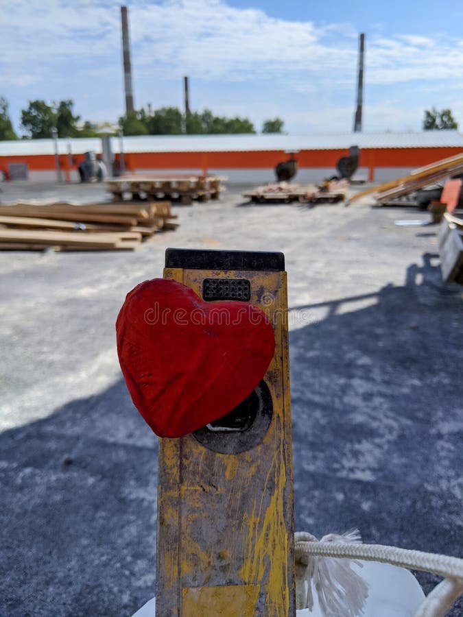 Red Heart Hanging on a Construction Tool Stock Photo - Image of hanging ...