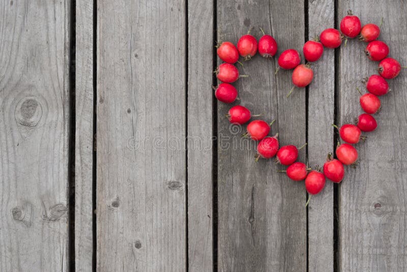 Red Heart of Hawthorn Berries on a Wooden Background Stock Image ...