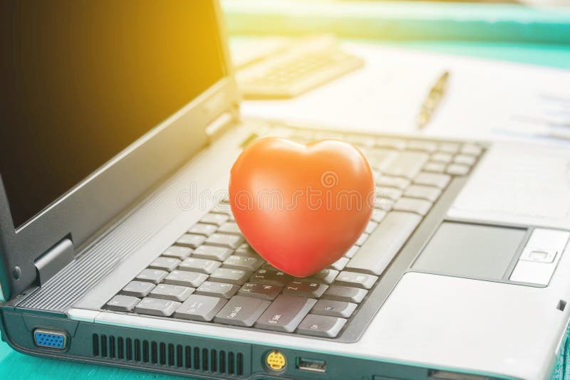 Red heart on laptop stock photo. Image of button, shadow - 92708180