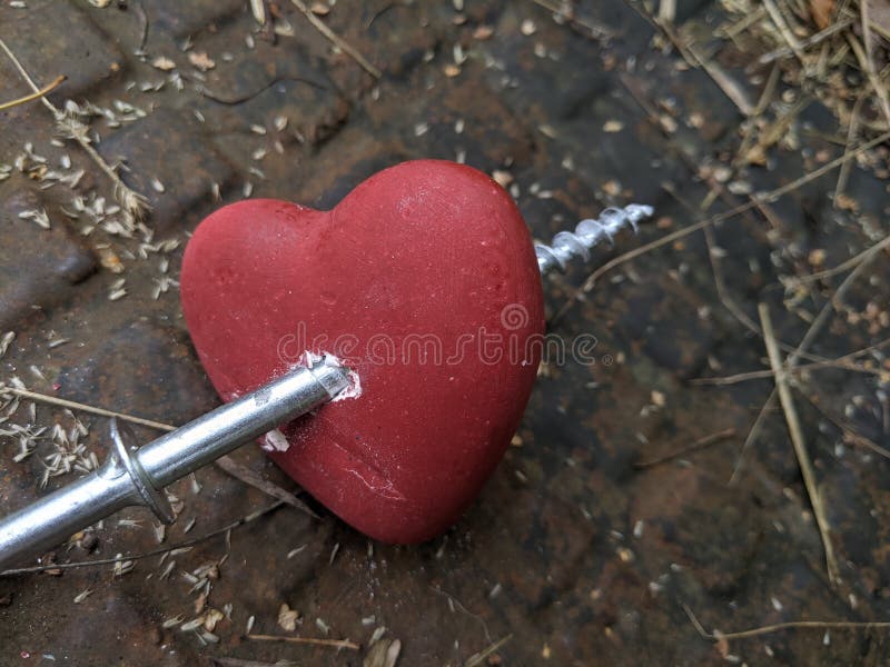 Red Heart Pierced with a Large with a Red Handle Stock Image - Image of ...