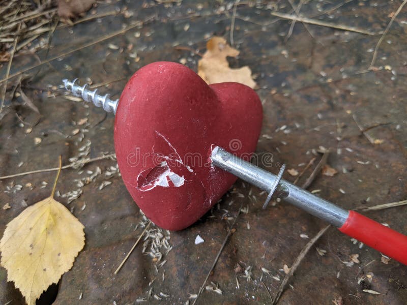 Red Heart Pierced with a Large with a Red Handle Stock Photo - Image of ...