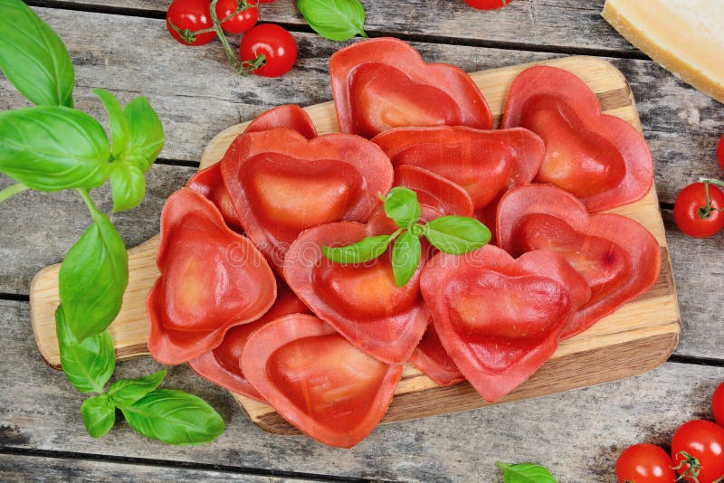 Red Heart Ravioli with Tomato, Mozzarella and Basil Stock Photo - Image ...