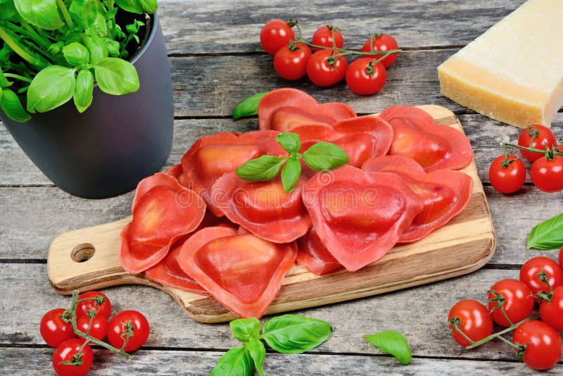 Red Heart Ravioli with Tomato, Mozzarella and Basil Stock Image - Image ...