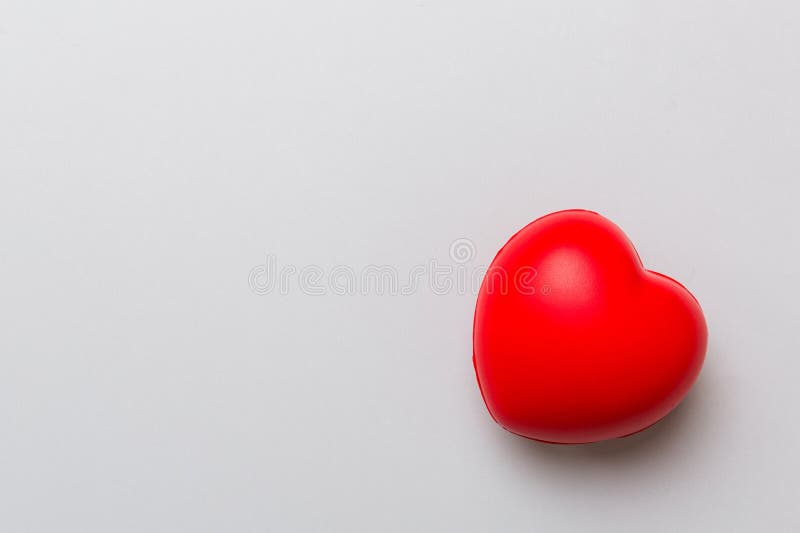 Red Heart Shape on Colored Background. Minimal Concept Top View with ...