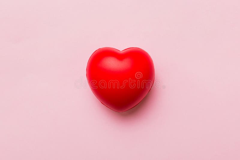 Red Heart Shape on Colored Background. Minimal Concept Top View with ...