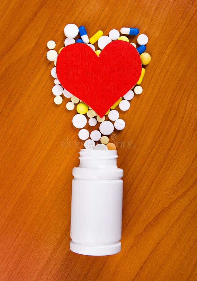 Pills and Heart Shape stock photo. Image of objects - 130191576