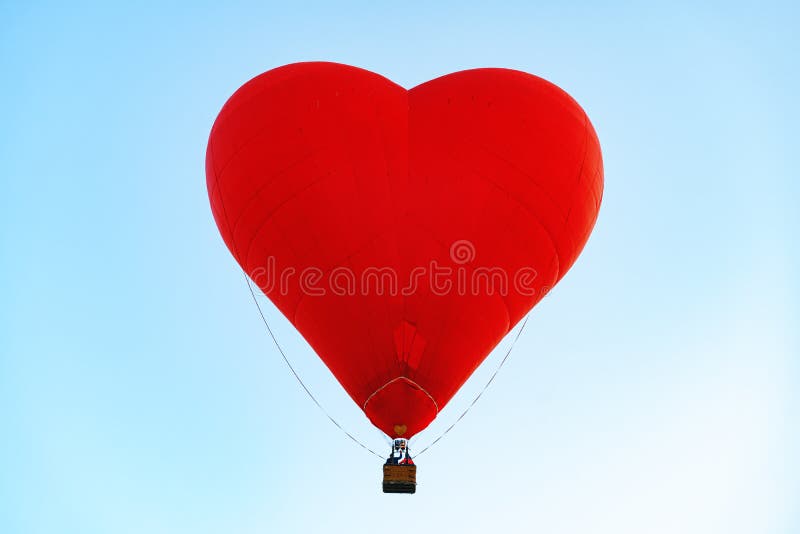 Red Heart-shaped Air Balloon Flying in the Sky Stock Photo - Image of ...