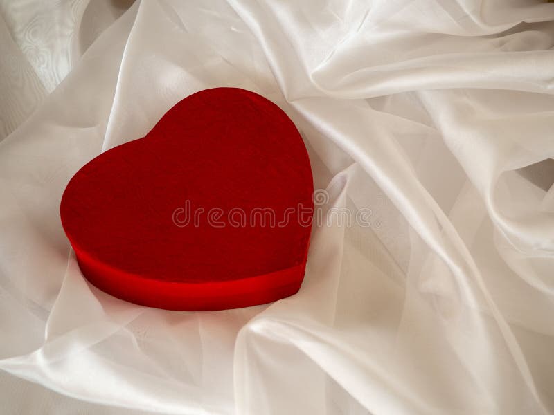 Red Heart-shaped Box on Silk Draped Surface Stock Image - Image of ...