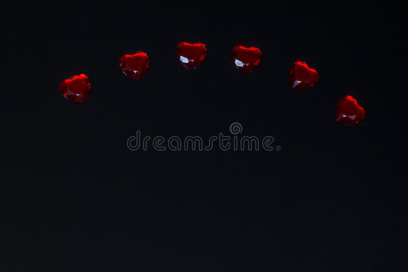 Red Heart Shaped Gemstones on Black Background Stock Photo - Image of ...