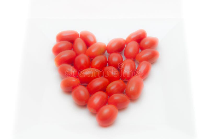 Red heart shaped tomatoes stock image. Image of plant - 64786013