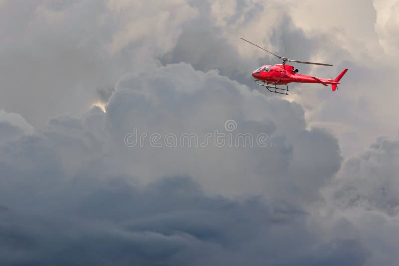 Red helicopter in flight stock image. Image of fuselage - 205614935