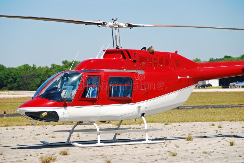 Red Helicopter on the Ground Stock Photo - Image of airfield, aircraft ...