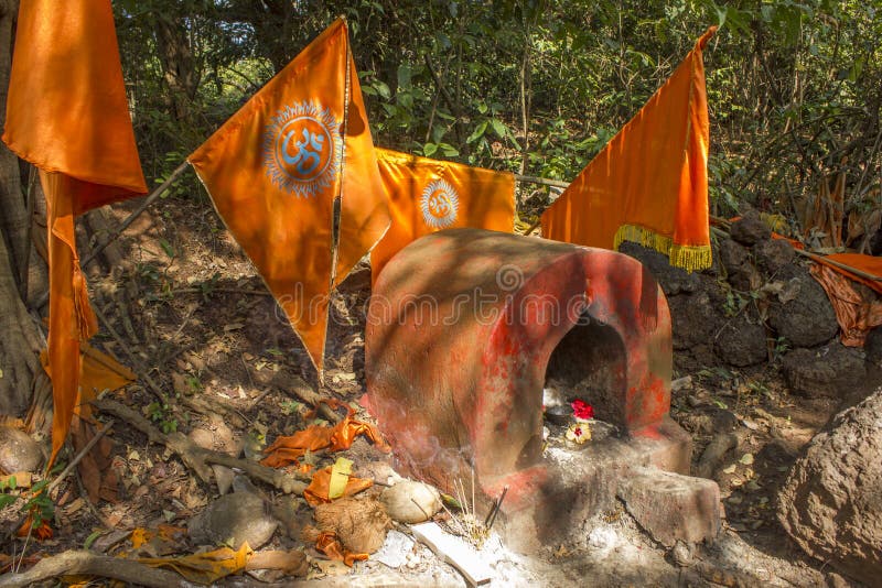 A Red Hindu Temple with Orange Flags in the Green Forest Stock Image ...