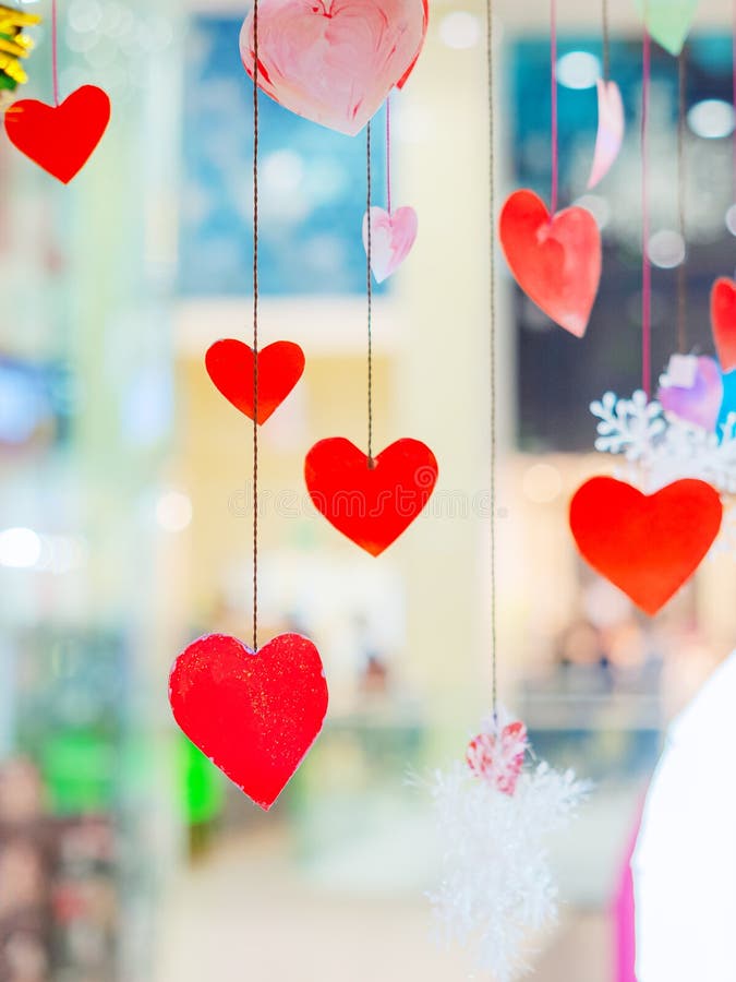 Red Homemade Paper Hearts Hang on Threads on Blurred Background Stock ...