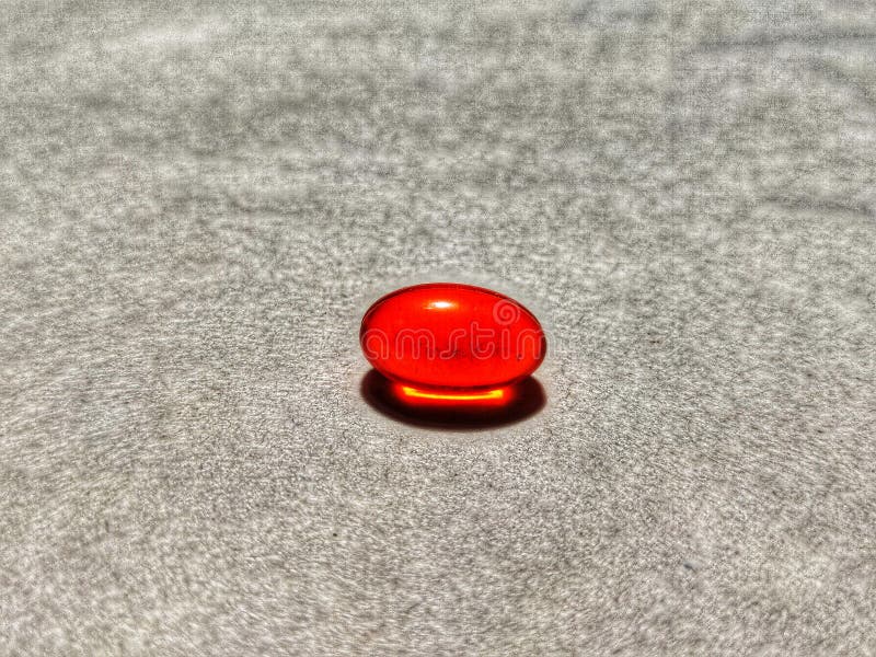 Red Hot Capsule Isolated in Concrete Background Stock Photo - Image of ...