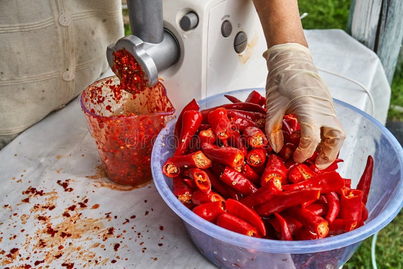 Red Hot Chili Pepper. Making Red Hot Chili Pepper Mash in a Grinder ...