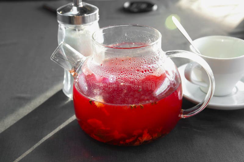 Red Hot Fruit Tea Brewed in a Glass Teapot Stock Photo - Image of ...