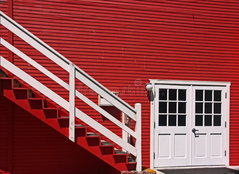 Red House Exterior with White Doors and Stairs Stock Image - Image of ...