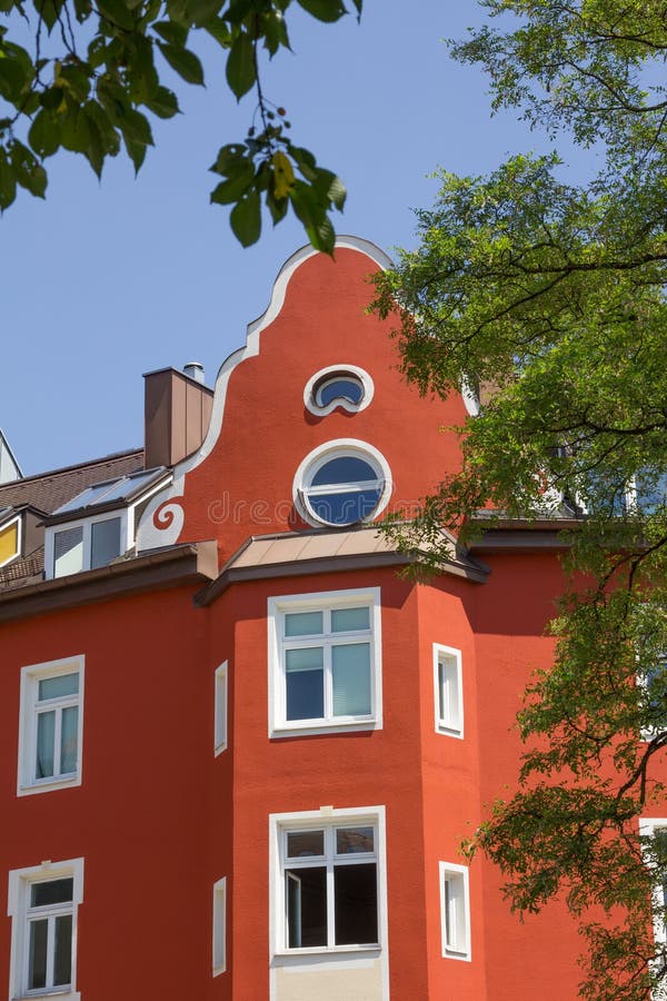 Red house facade in munich stock photo. Image of wall - 55862422