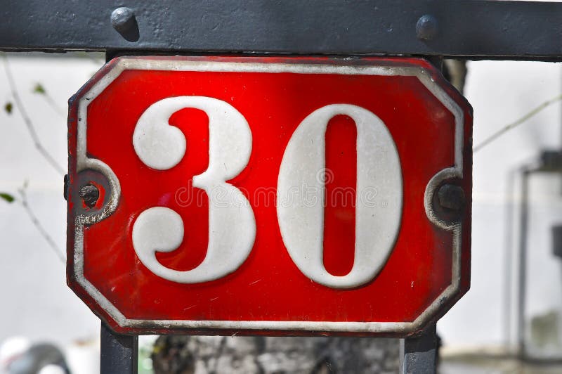 A Red House Number Plaque, Showing the Number Thirty Stock Image ...